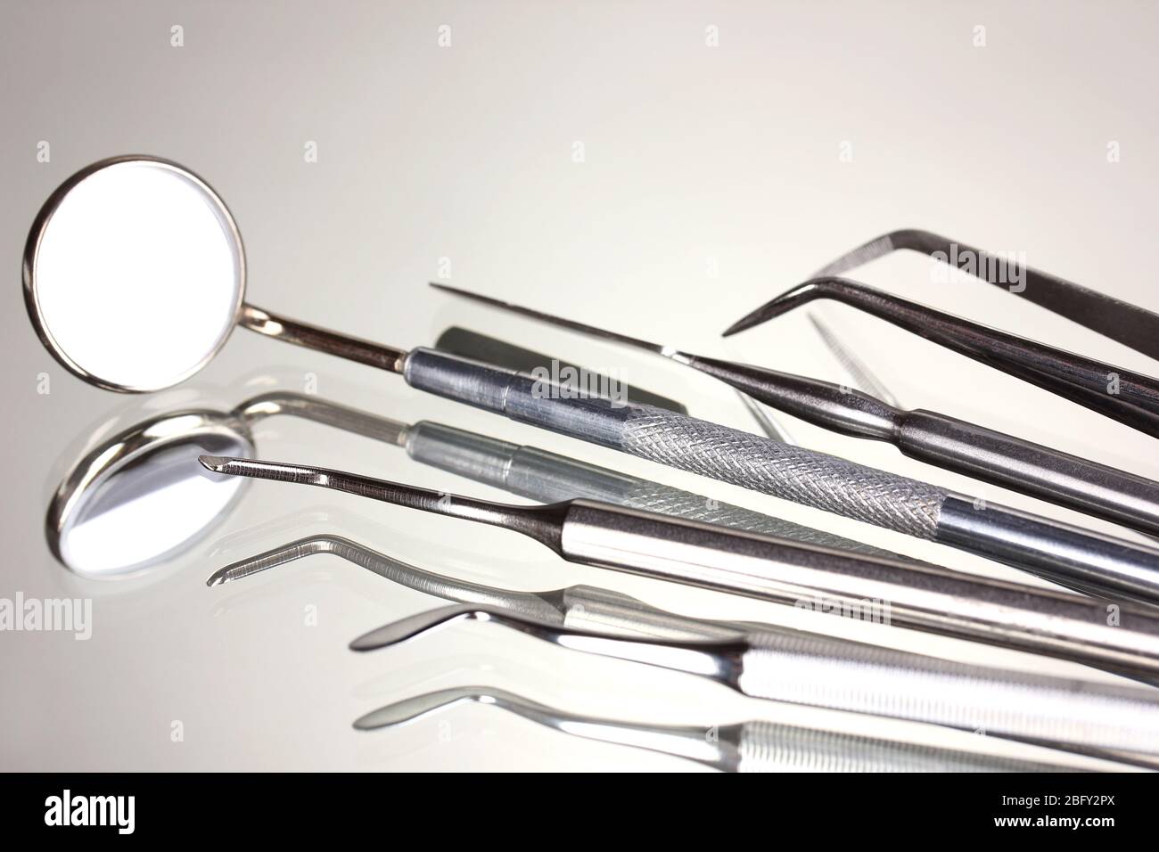 Set of dental tools for teeth care isolated on grey background Stock ...
