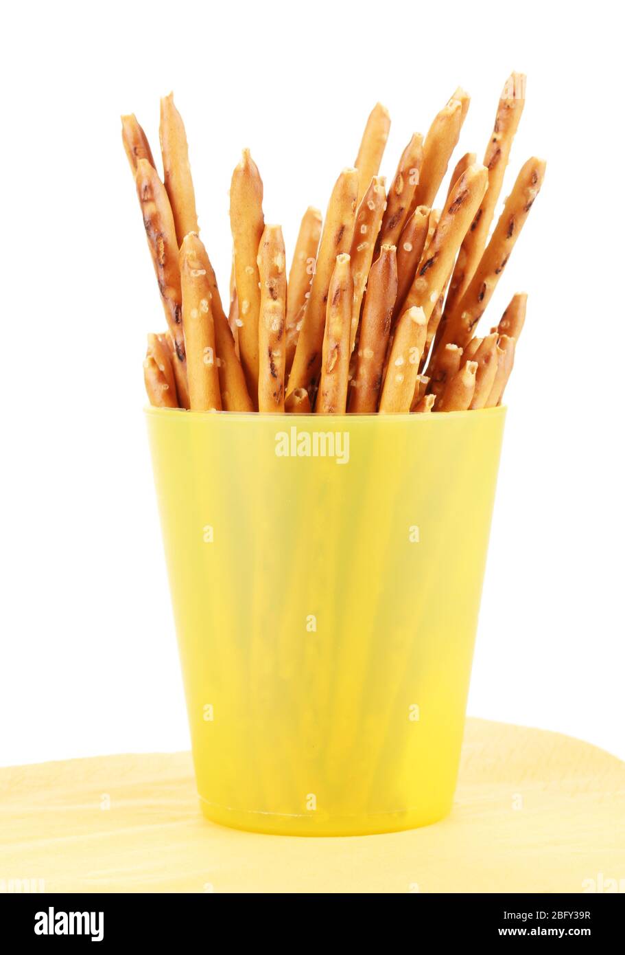 Tasty crispy sticks in yellow plastic cup isolated on white Stock Photo ...