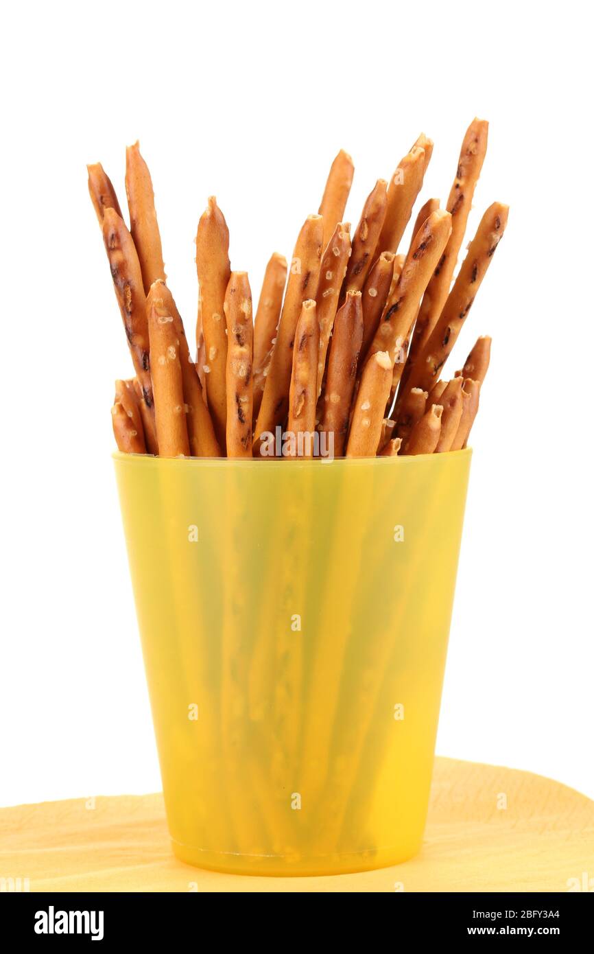 Tasty crispy sticks in yellow plastic cup isolated on white Stock Photo ...