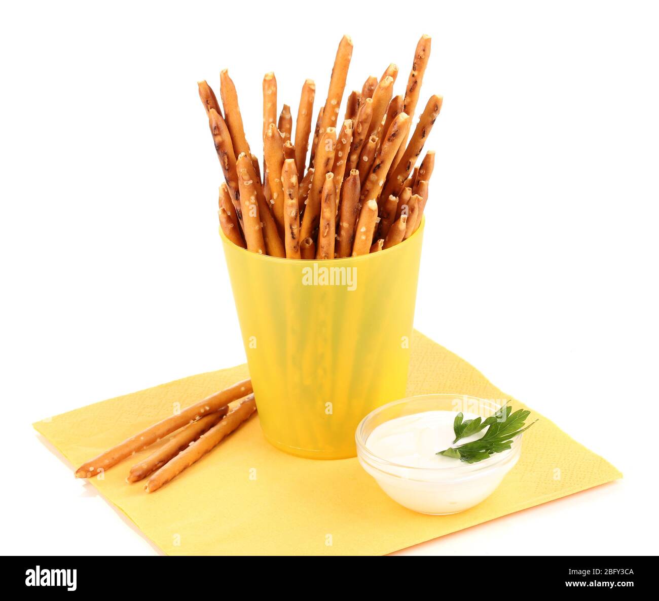 Tasty crispy sticks in yellow plastic cup isolated on white Stock Photo ...