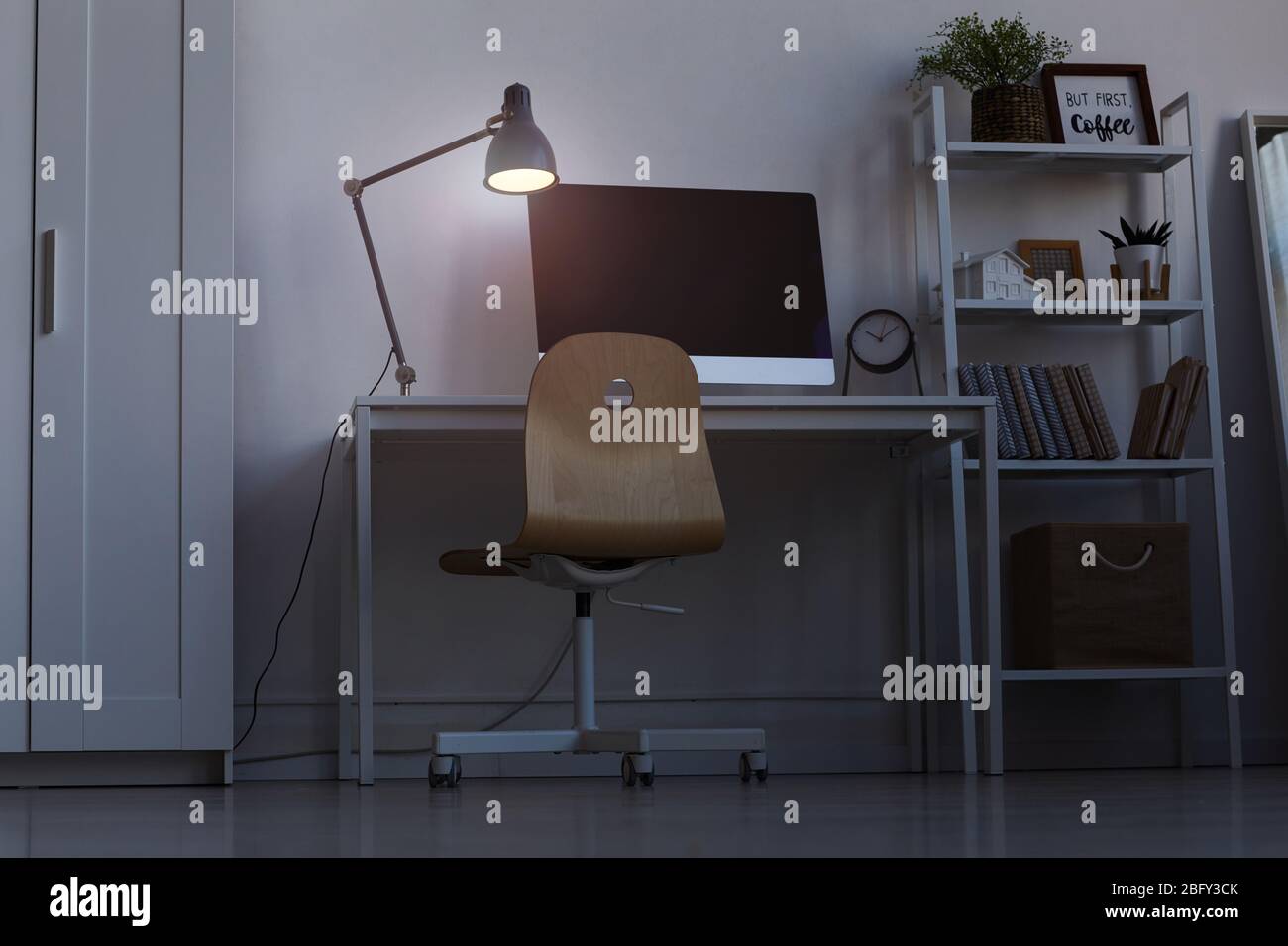 Full length background image of home office workplace at night, with ...