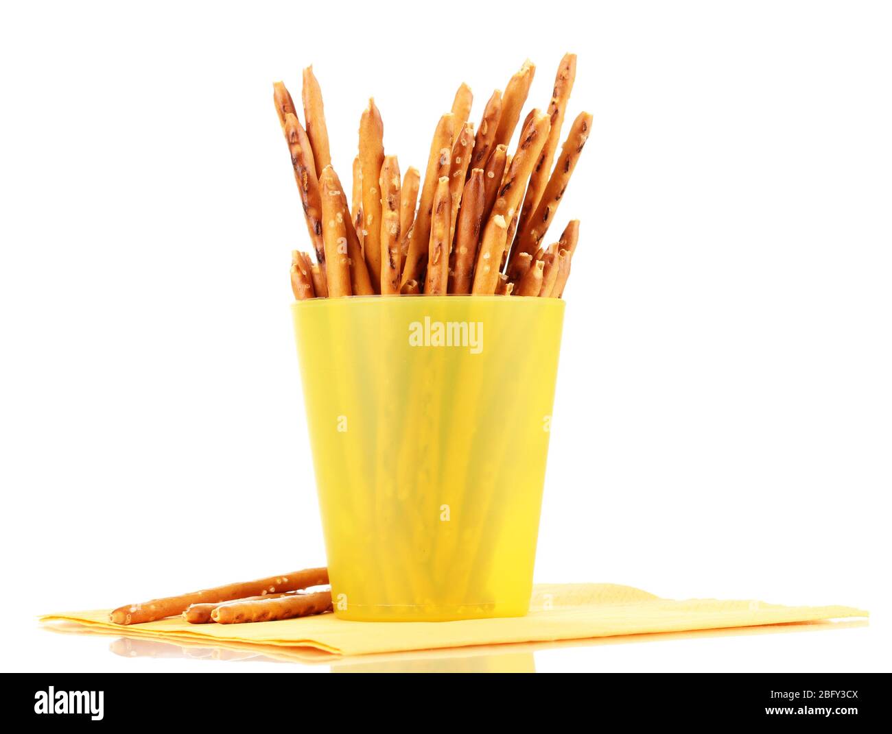 Tasty crispy sticks in yellow plastic cup isolated on white Stock Photo ...