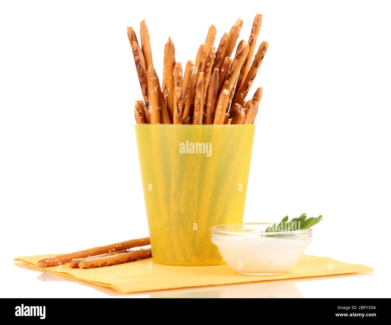 Tasty crispy sticks in yellow plastic cup isolated on white Stock Photo ...