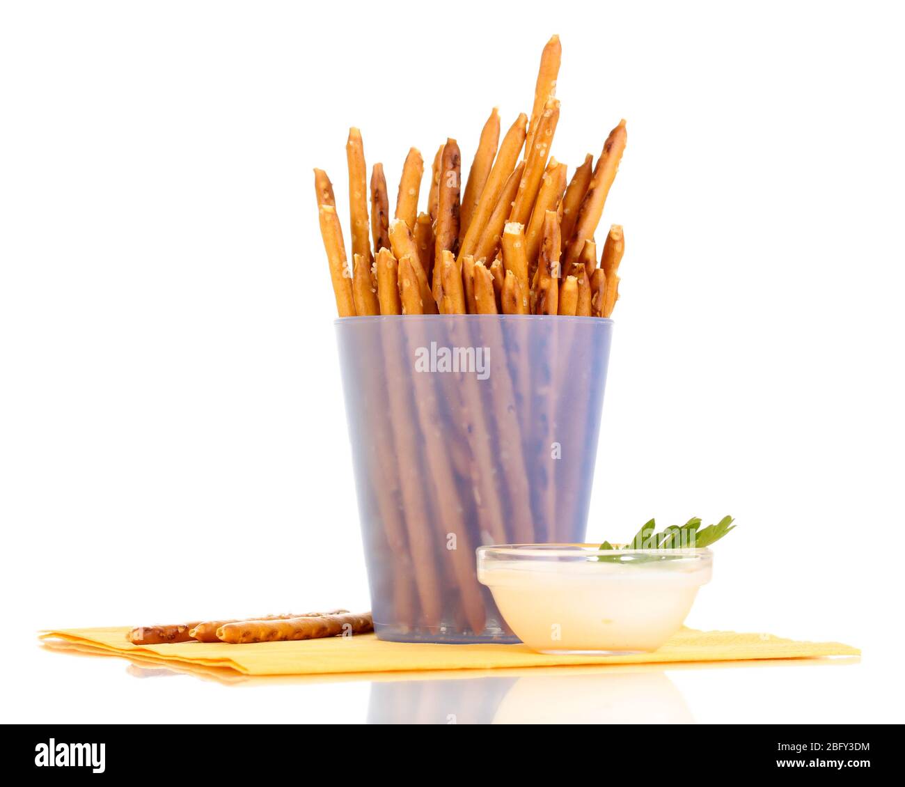 Tasty crispy sticks in purple plastic cup isolated on white Stock Photo ...