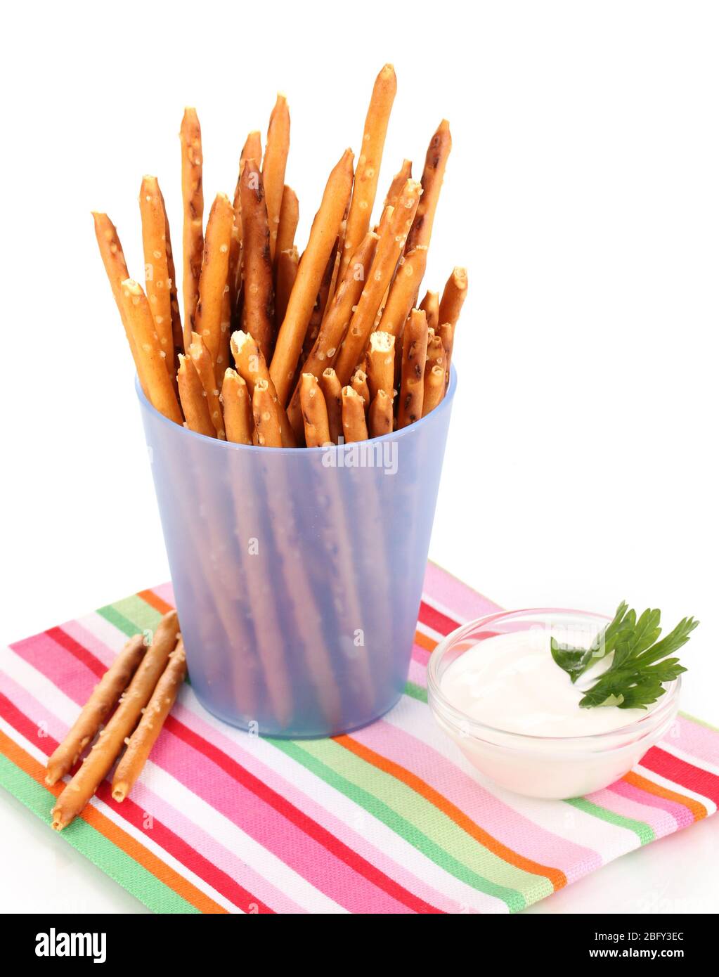 Tasty crispy sticks in purple plastic cup isolated on white Stock Photo ...