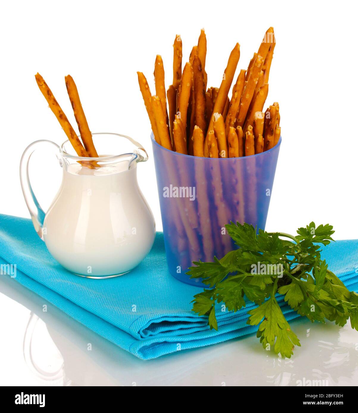 Tasty crispy sticks in purple plastic cup isolated on white Stock Photo ...