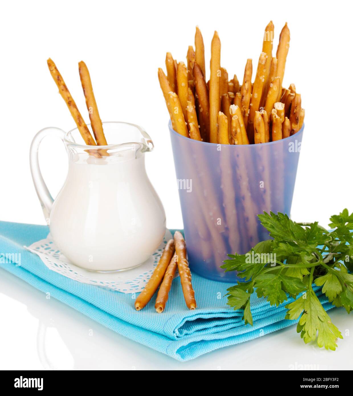 Tasty crispy sticks in purple plastic cup isolated on white Stock Photo ...