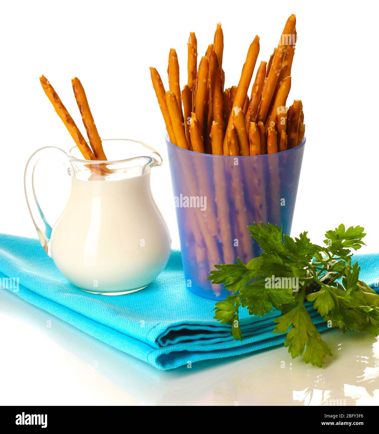 Tasty crispy sticks in purple plastic cup isolated on white Stock Photo ...