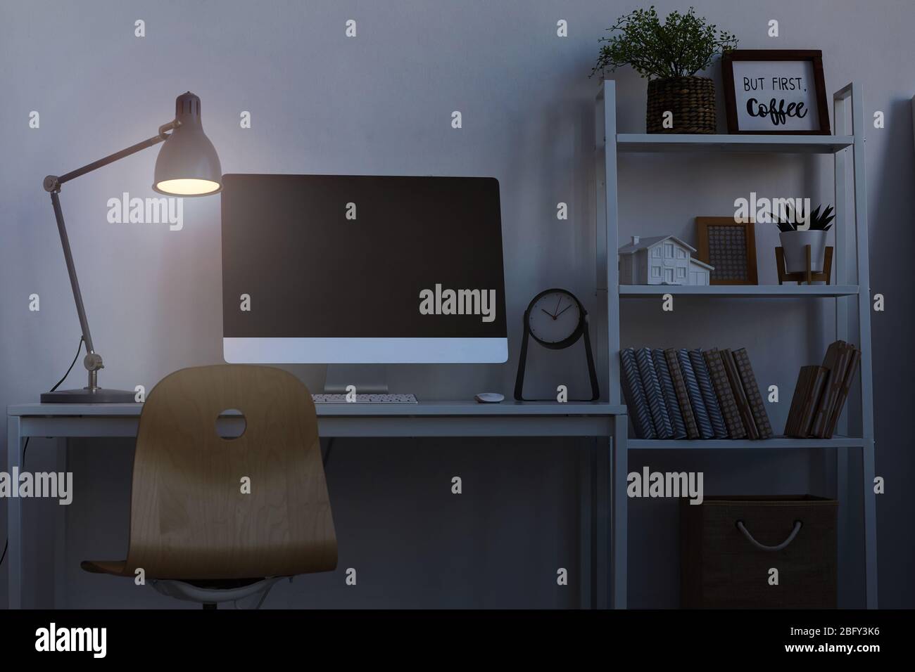 Background image of home office workplace at night, with focus on ...