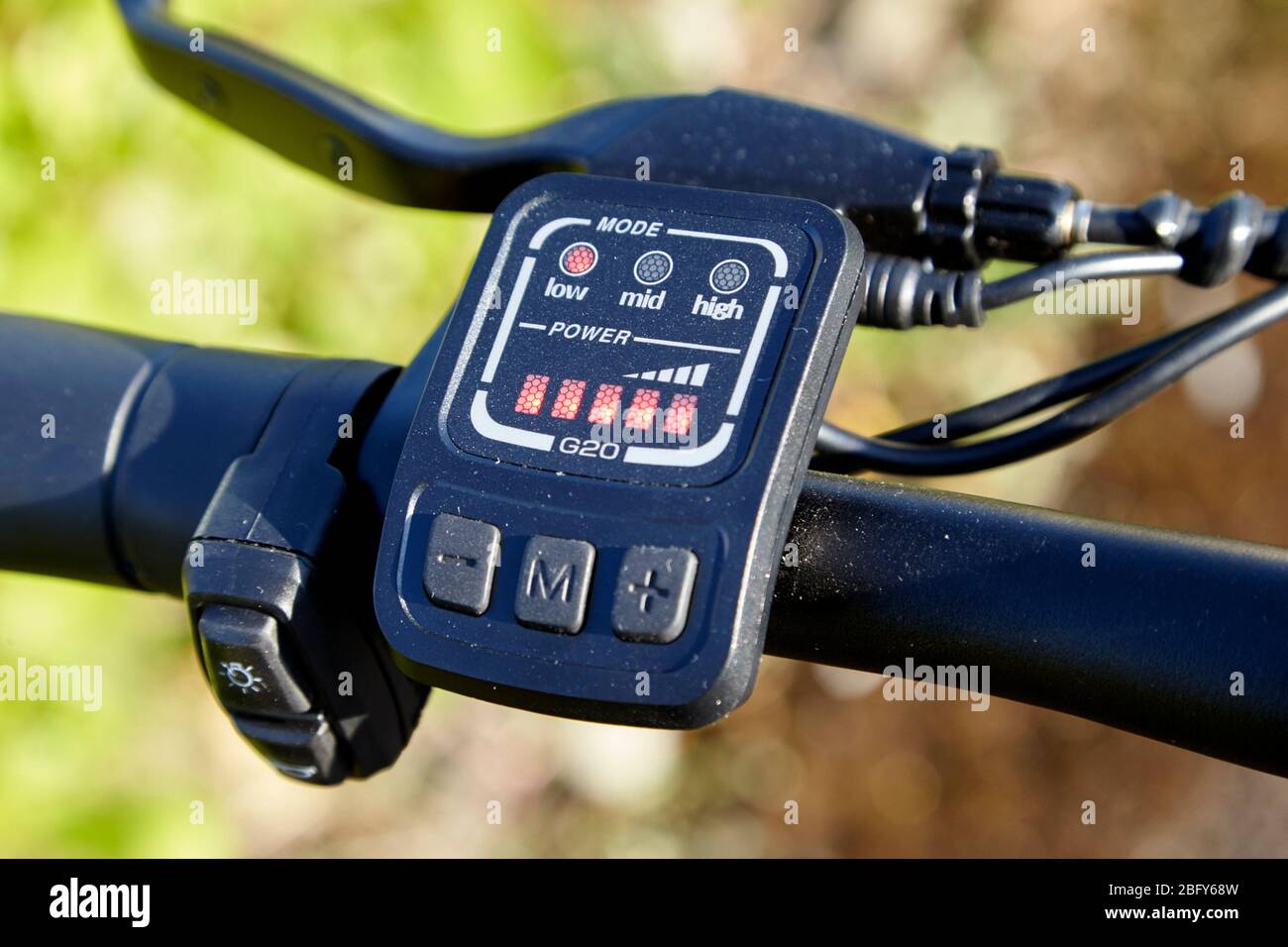 simple power controls on an e-bike in the uk Stock Photo - Alamy