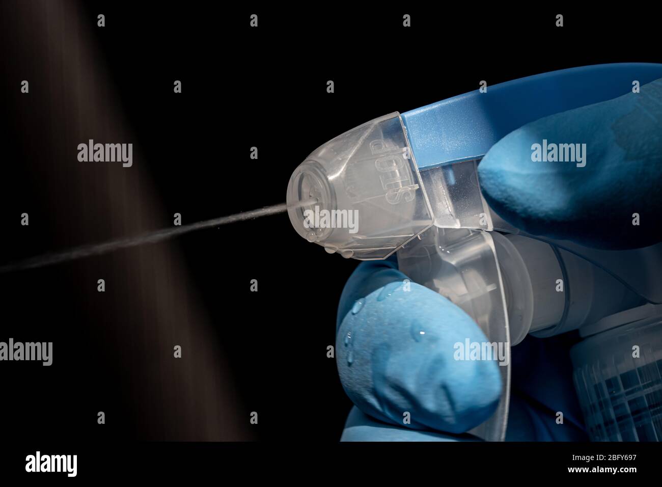 The detailed look of bottle spray when squirt solution, macro view ...