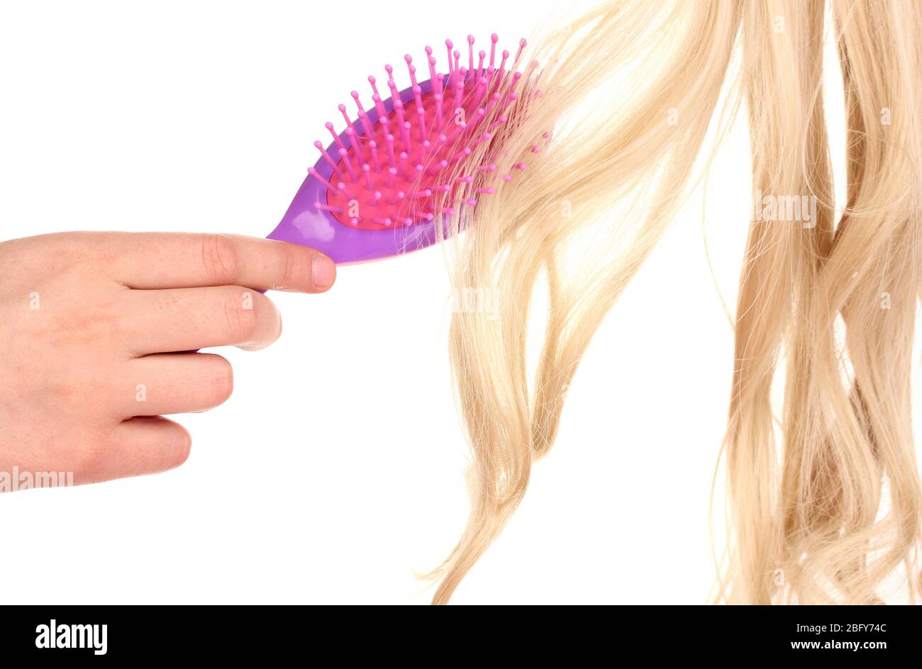 Blond curls brushing comb isolated on white Stock Photo - Alamy