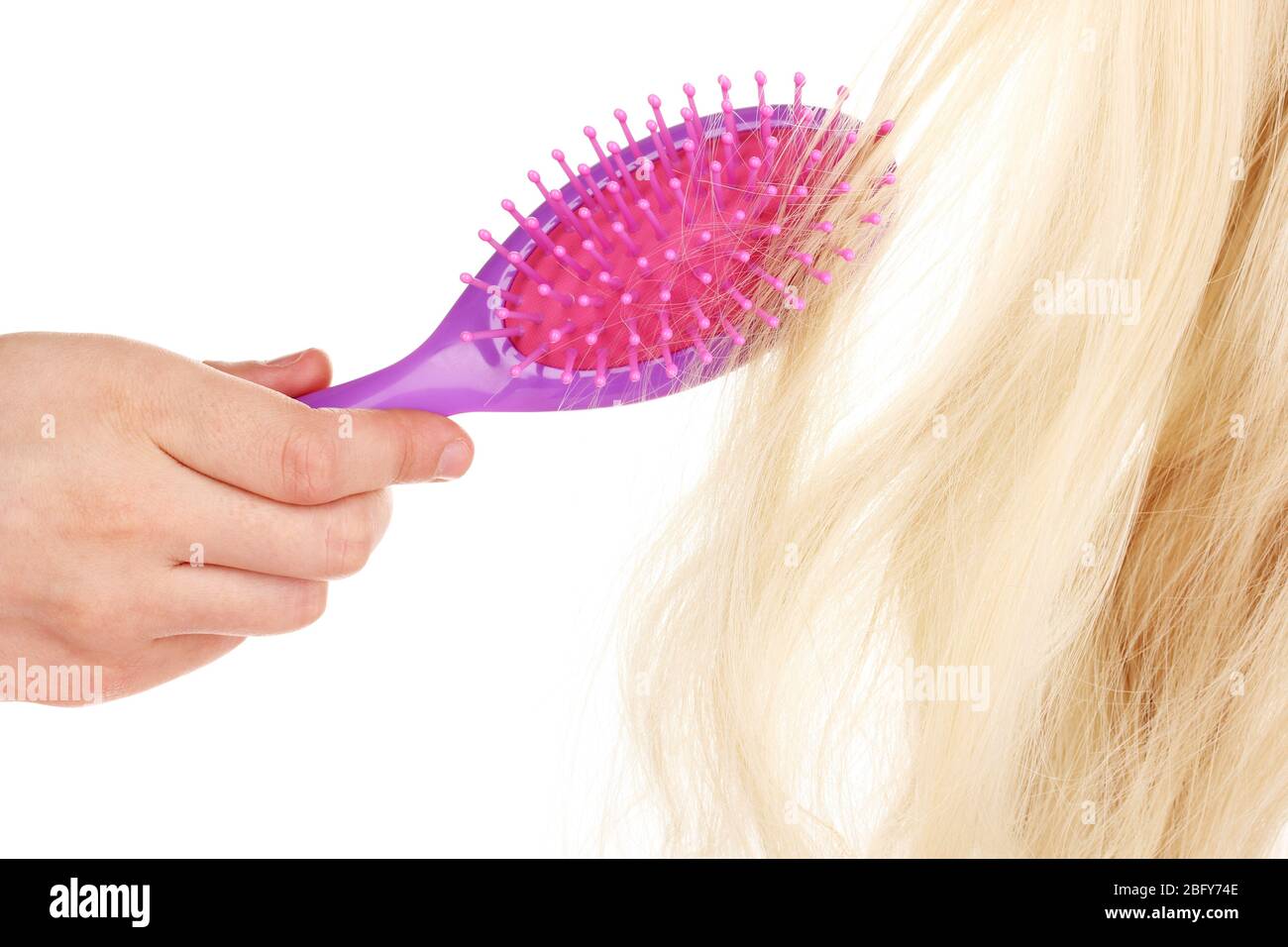 Blond curls brushing comb isolated on white Stock Photo - Alamy