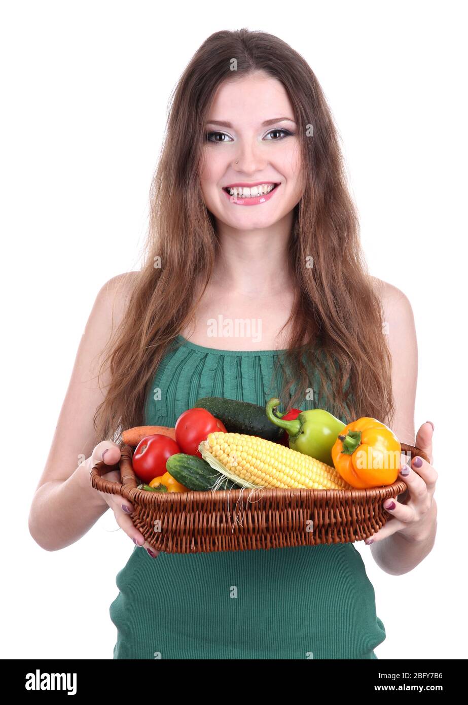 Beautiful woman with vegetables in wicker basket isolated on white ...