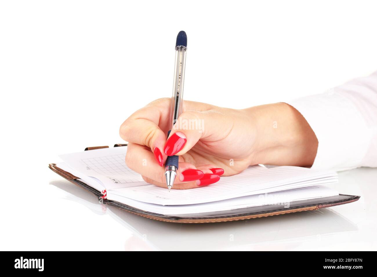 Hand signing in notebook isolated on white Stock Photo - Alamy
