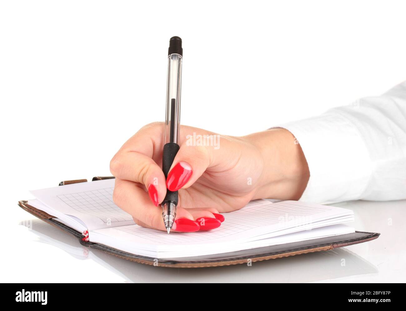 Hand signing in notebook isolated on white Stock Photo - Alamy