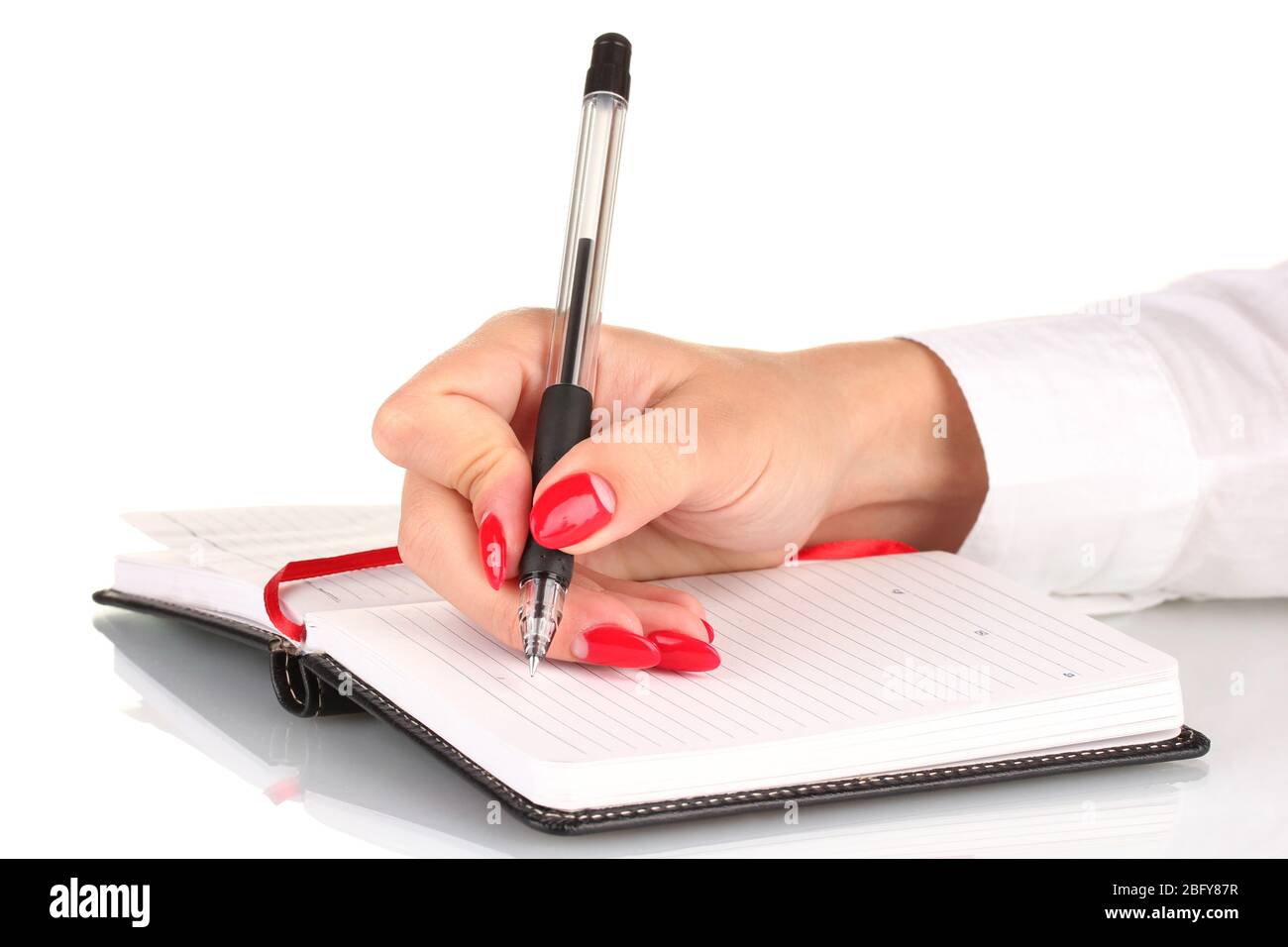 Hand signing in notebook isolated on white Stock Photo - Alamy