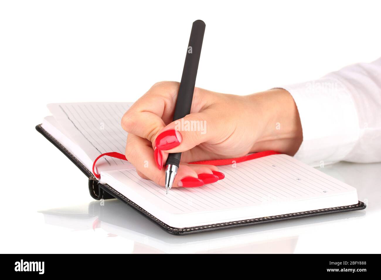 Hand signing in notebook isolated on white Stock Photo - Alamy