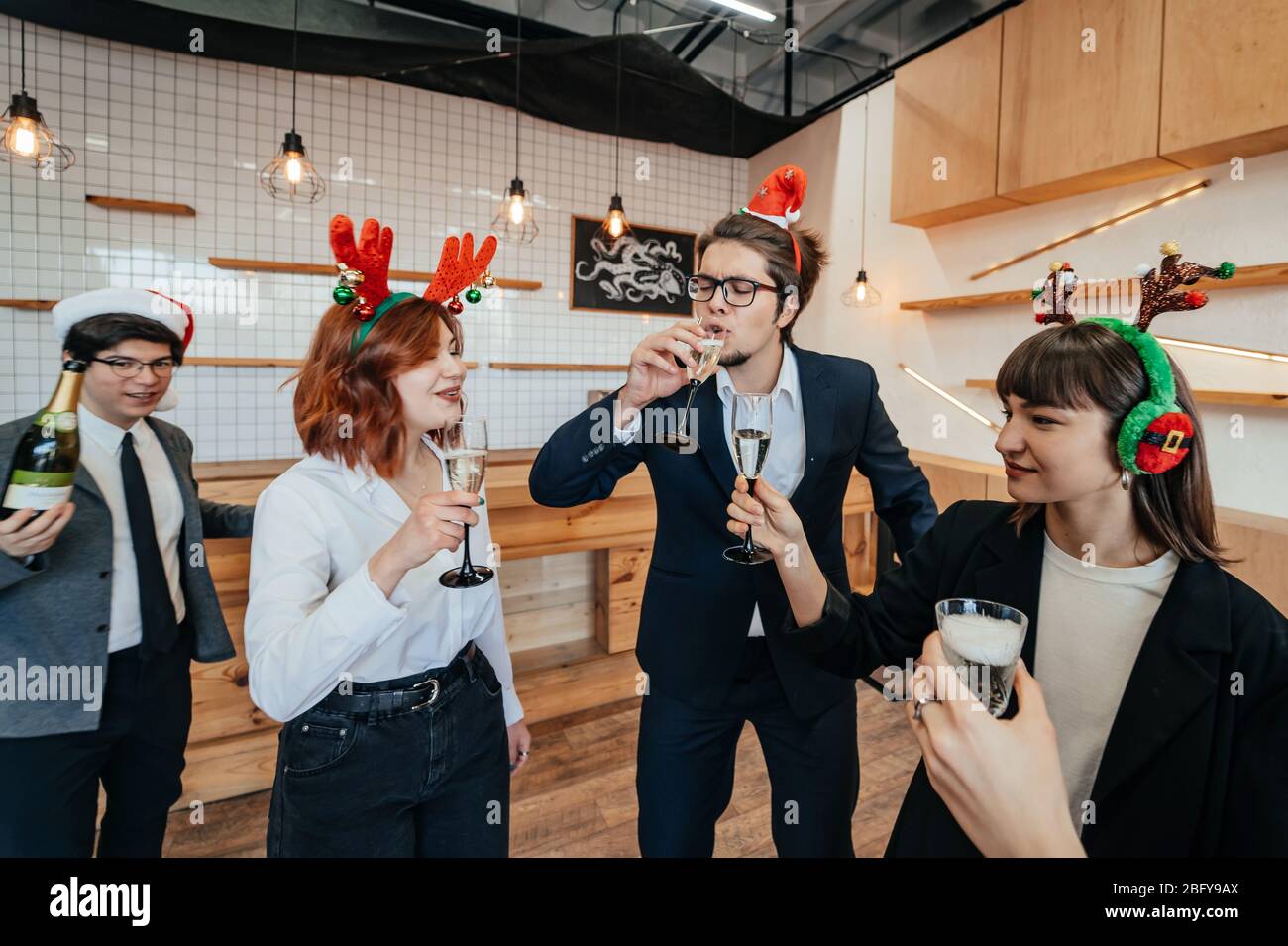 Happy colleagues in office celebrate special event Stock Photo - Alamy