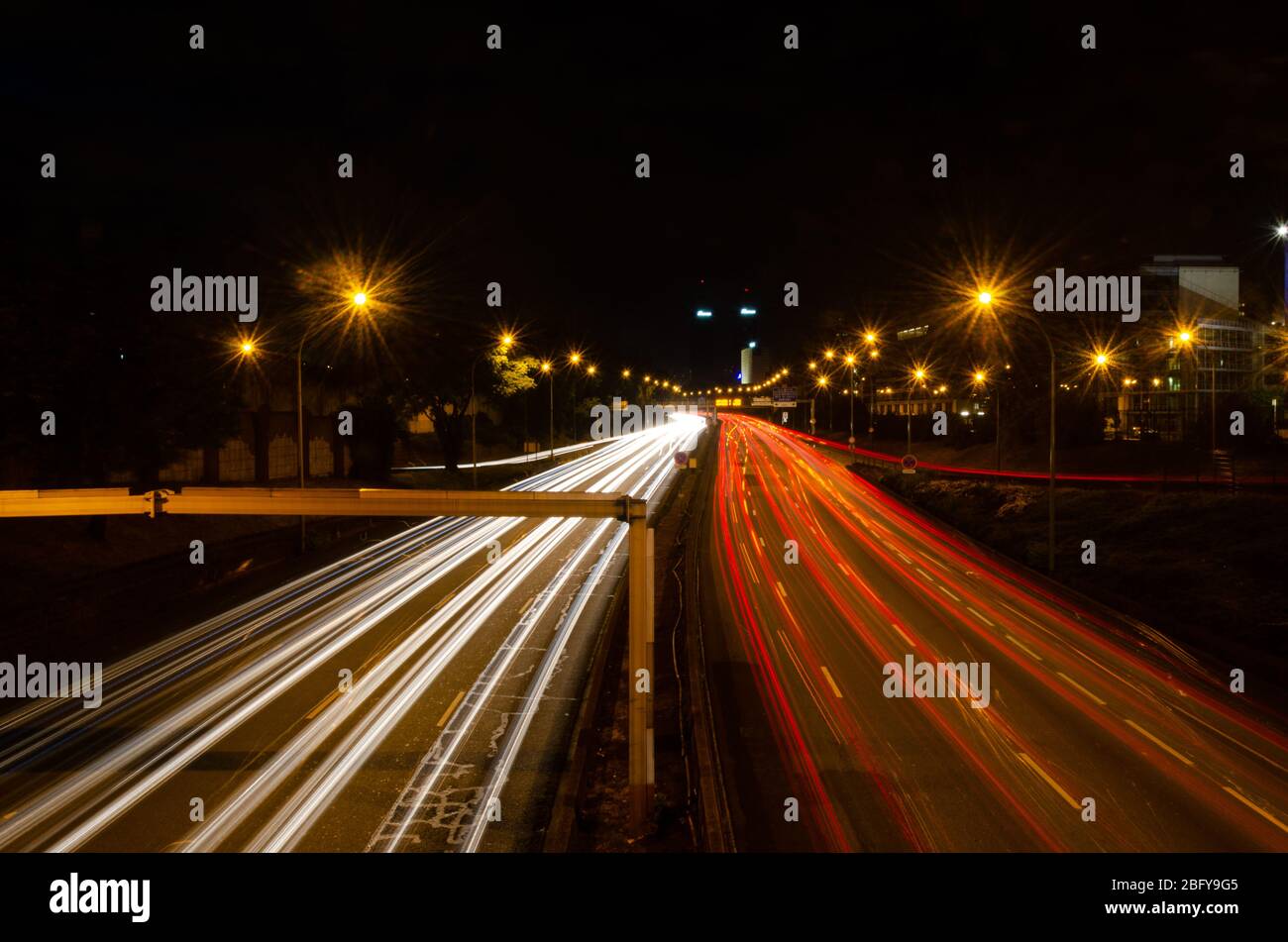 View of traffic on a busy main road in Paris at night Stock Photo - Alamy