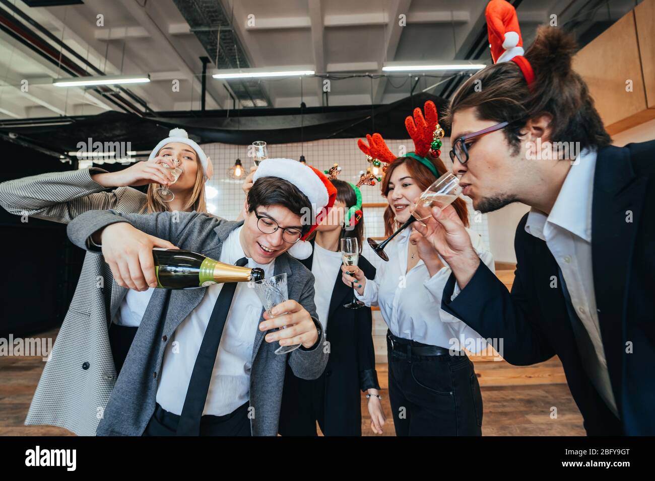 Happy colleagues in office celebrate special event Stock Photo - Alamy