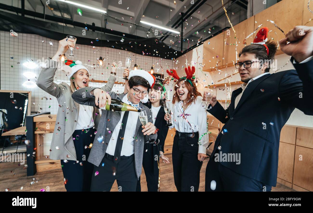 Happy colleagues in office celebrate special event Stock Photo - Alamy