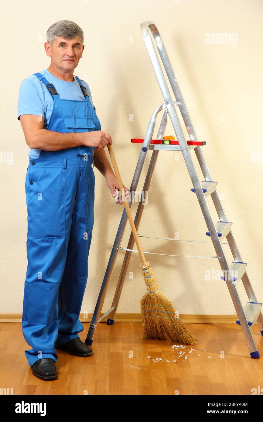 Workman sweeping broom hi-res stock photography and images - Alamy