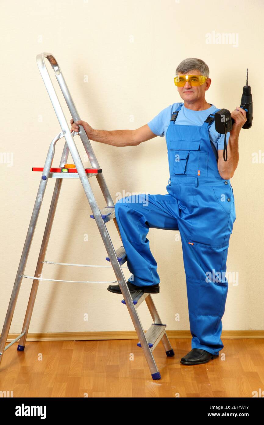 Workman Standing Ladder High Resolution Stock Photography and Images ...