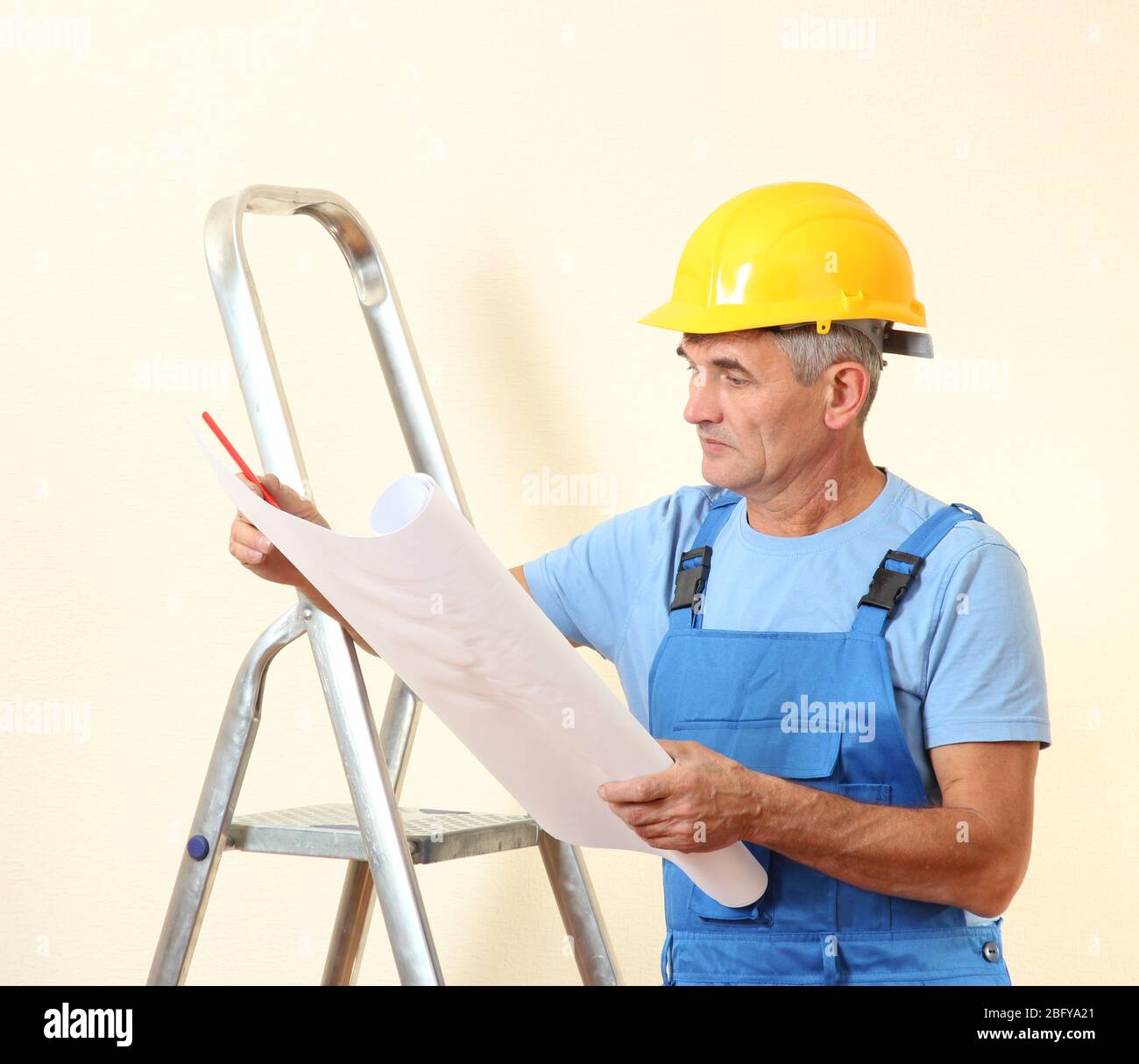 Architect studying construction project Stock Photo - Alamy