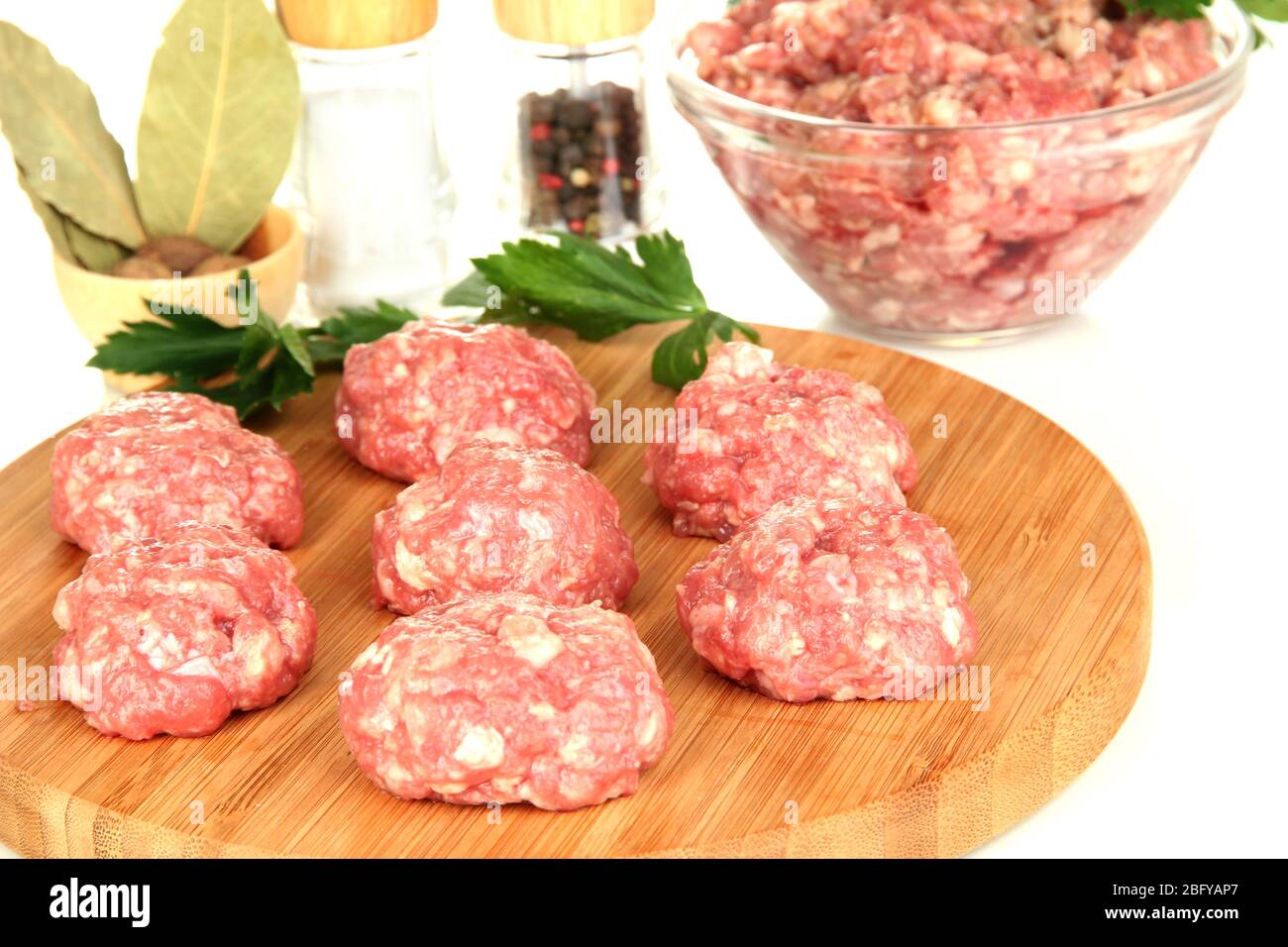 Raw meatballs with spices Stock Photo - Alamy