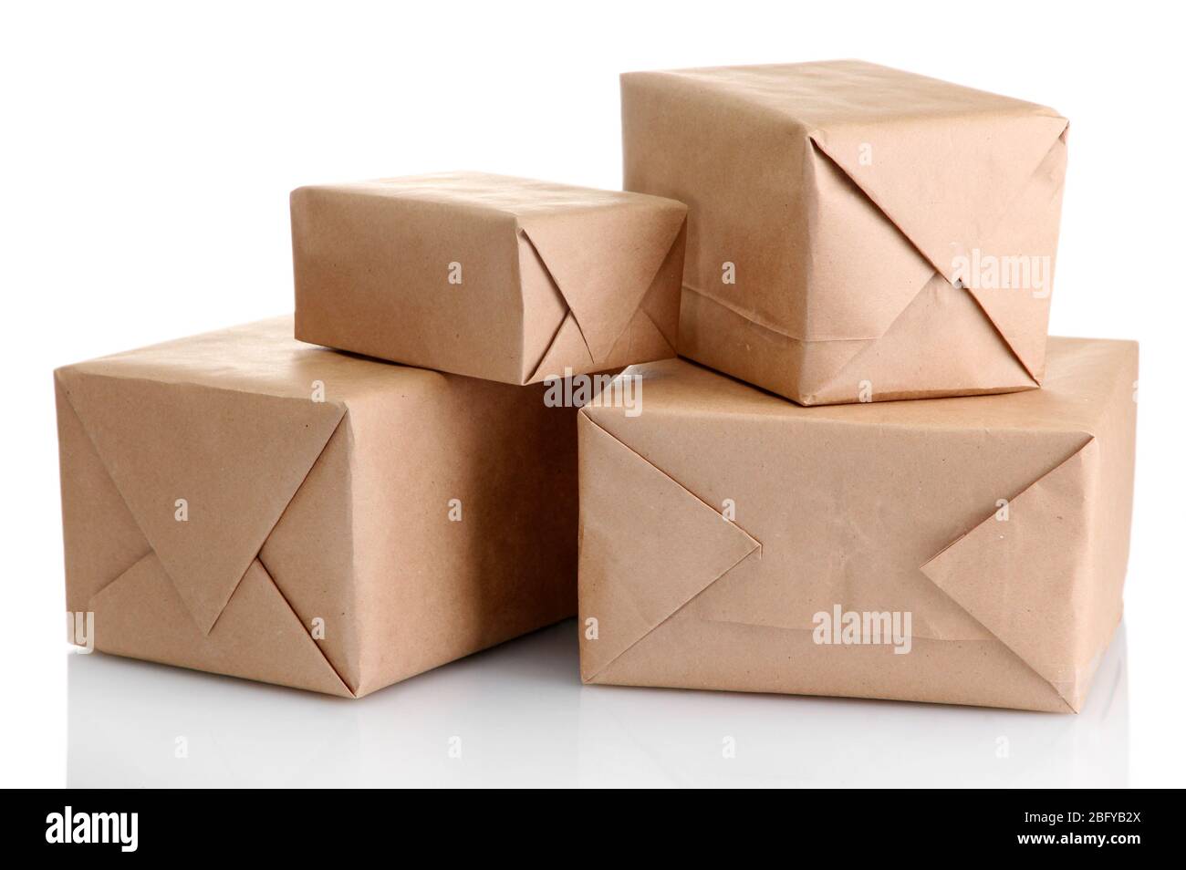 parcels boxes with kraft paper, isolated on white Stock Photo - Alamy