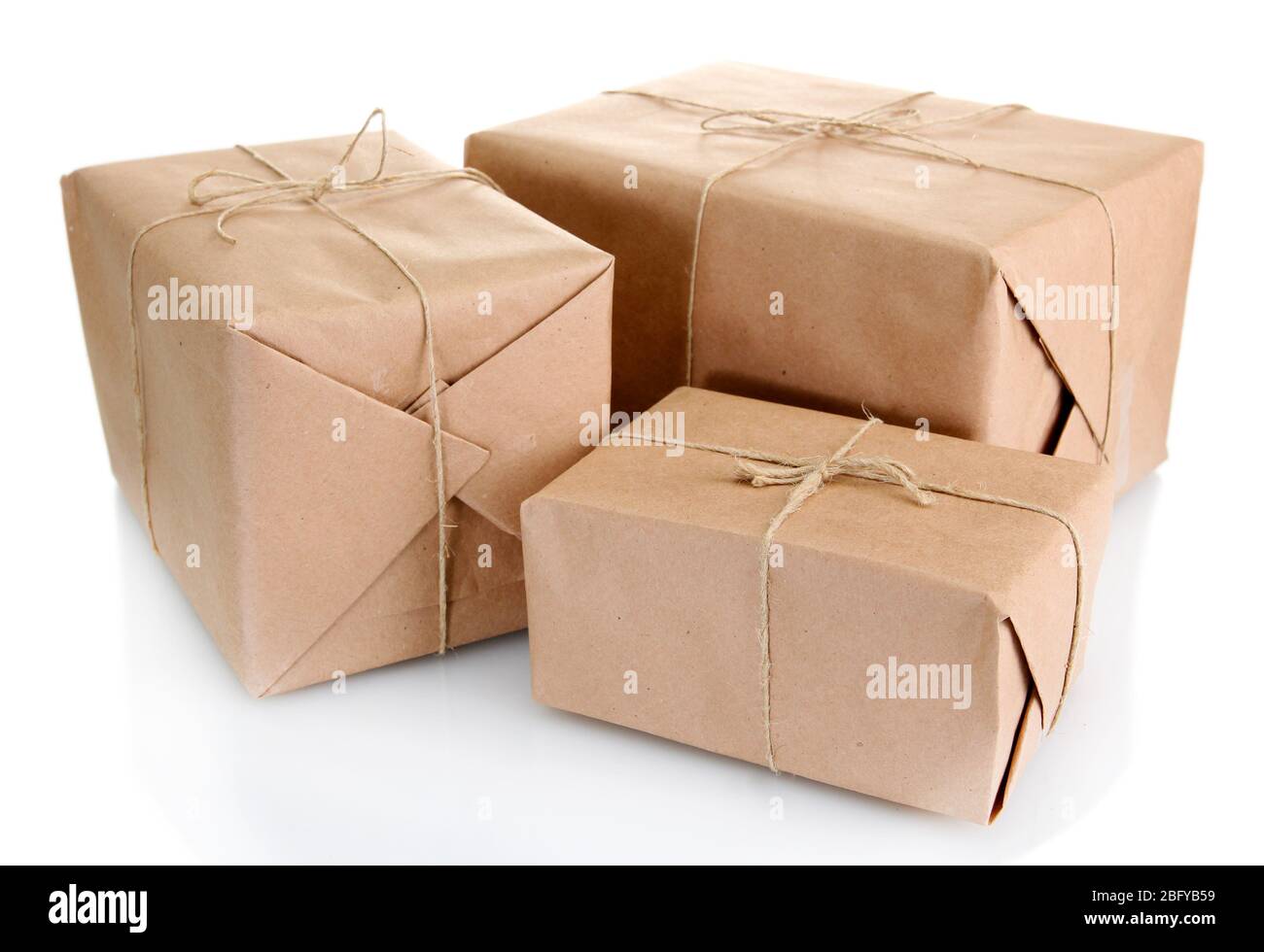 parcels boxes with kraft paper, isolated on white Stock Photo - Alamy