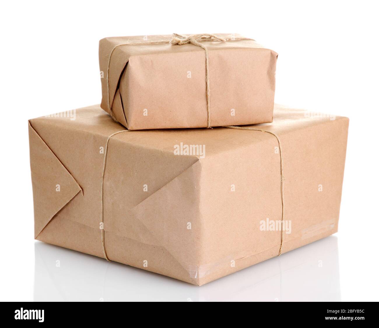 parcels boxes with kraft paper, isolated on white Stock Photo - Alamy
