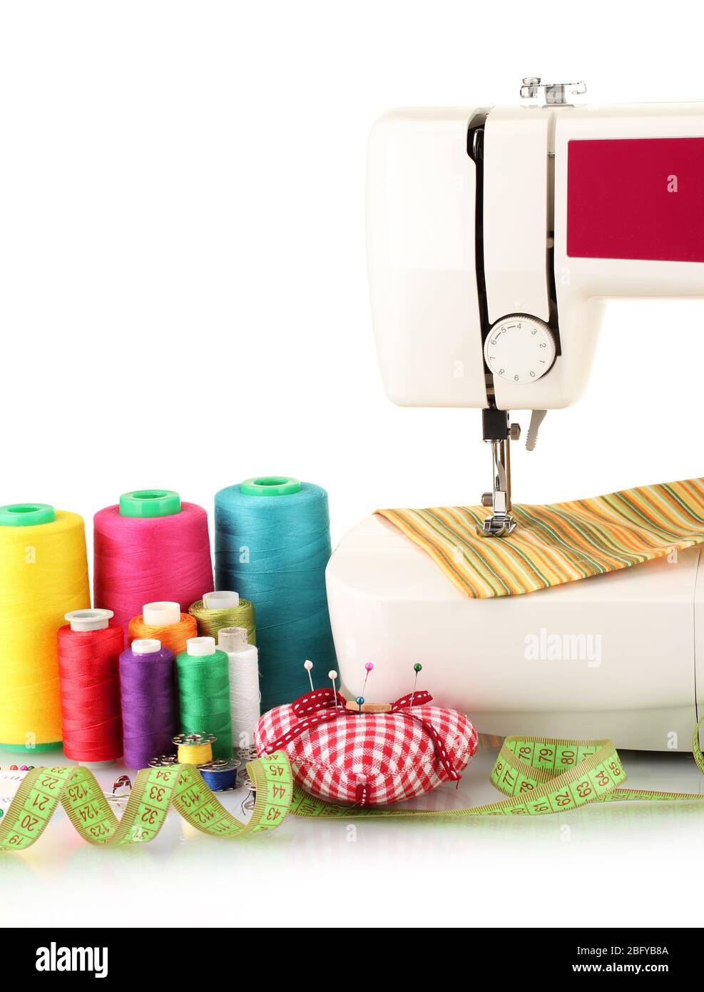 sewing machine and fabric isolated on white Stock Photo - Alamy