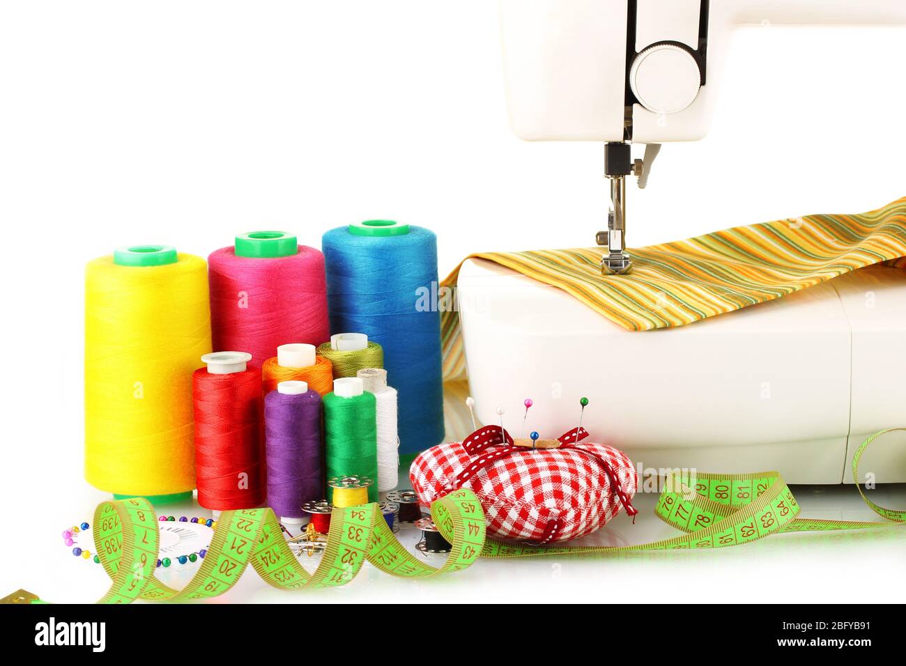 sewing machine and fabric isolated on white Stock Photo - Alamy