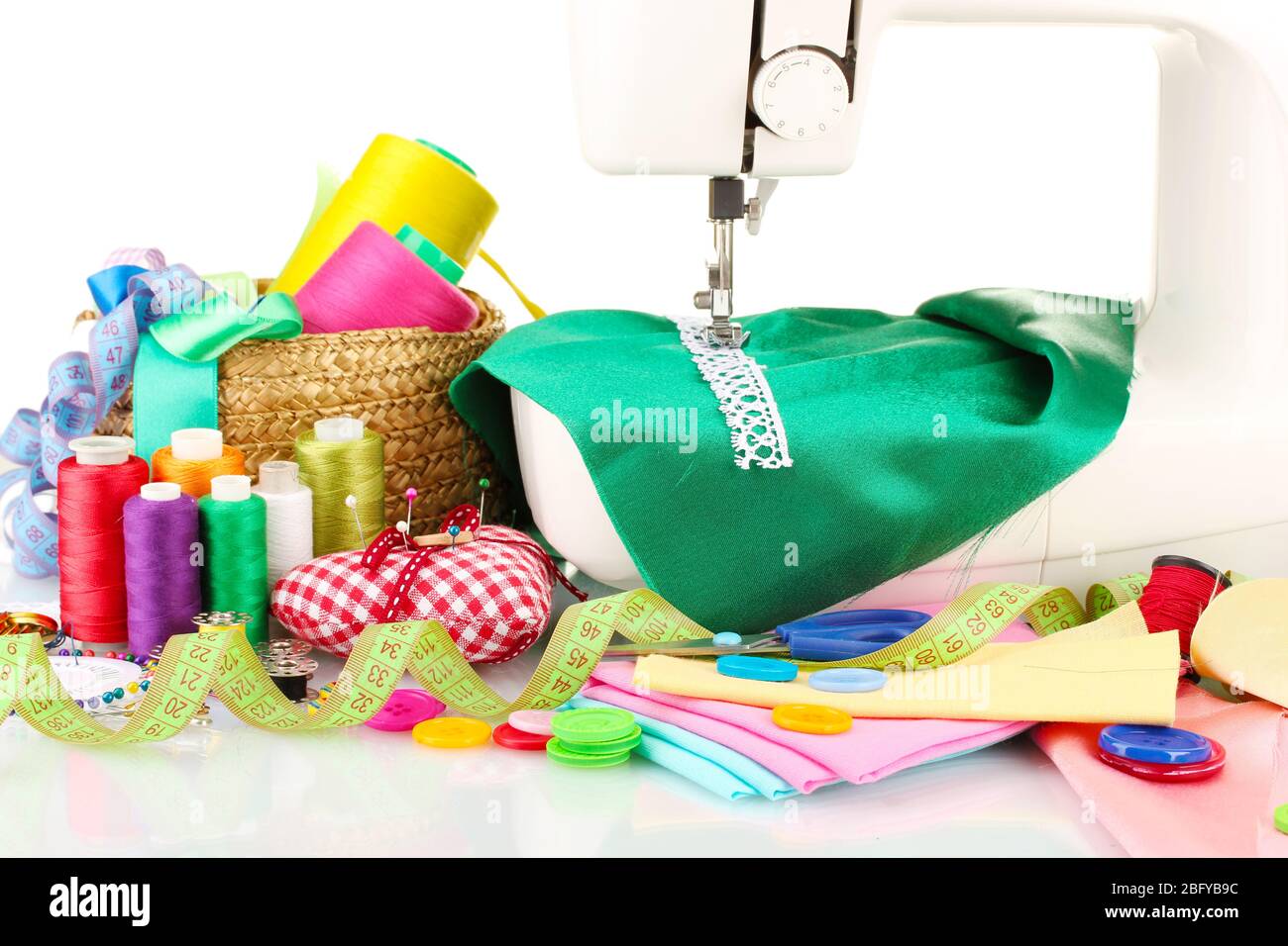 sewing machine and fabric isolated on white Stock Photo - Alamy
