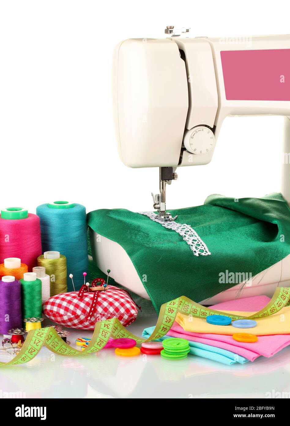 sewing machine and fabric isolated on white Stock Photo - Alamy