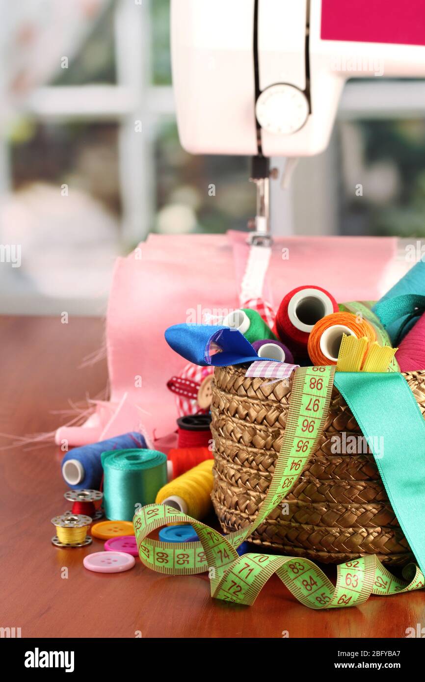 sewing machine and fabric on bright background Stock Photo - Alamy