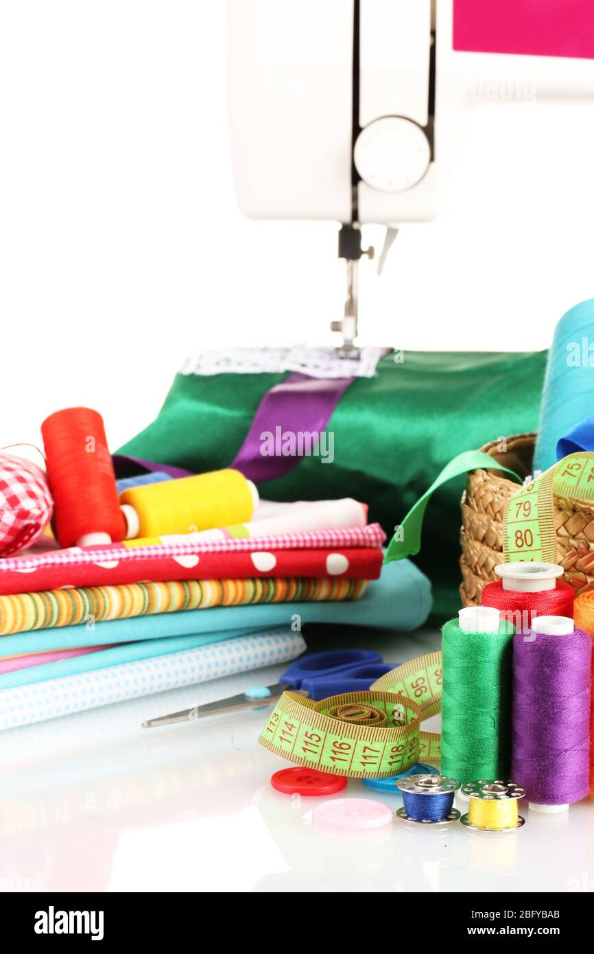 sewing machine and fabric isolated on white Stock Photo - Alamy