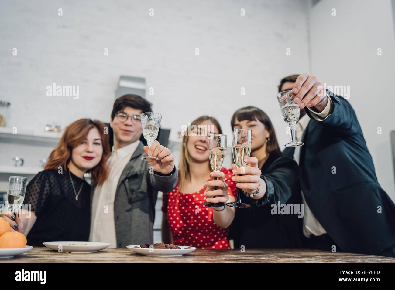 Happy colleagues in office celebrate special event Stock Photo - Alamy