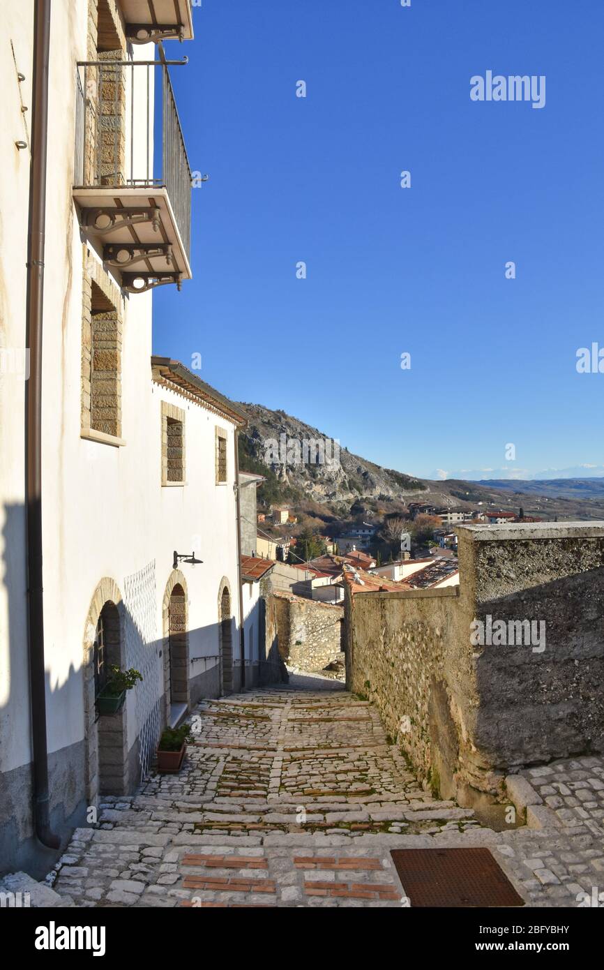 A narrow street between the old houses of Roccamandolfi in the Molise ...