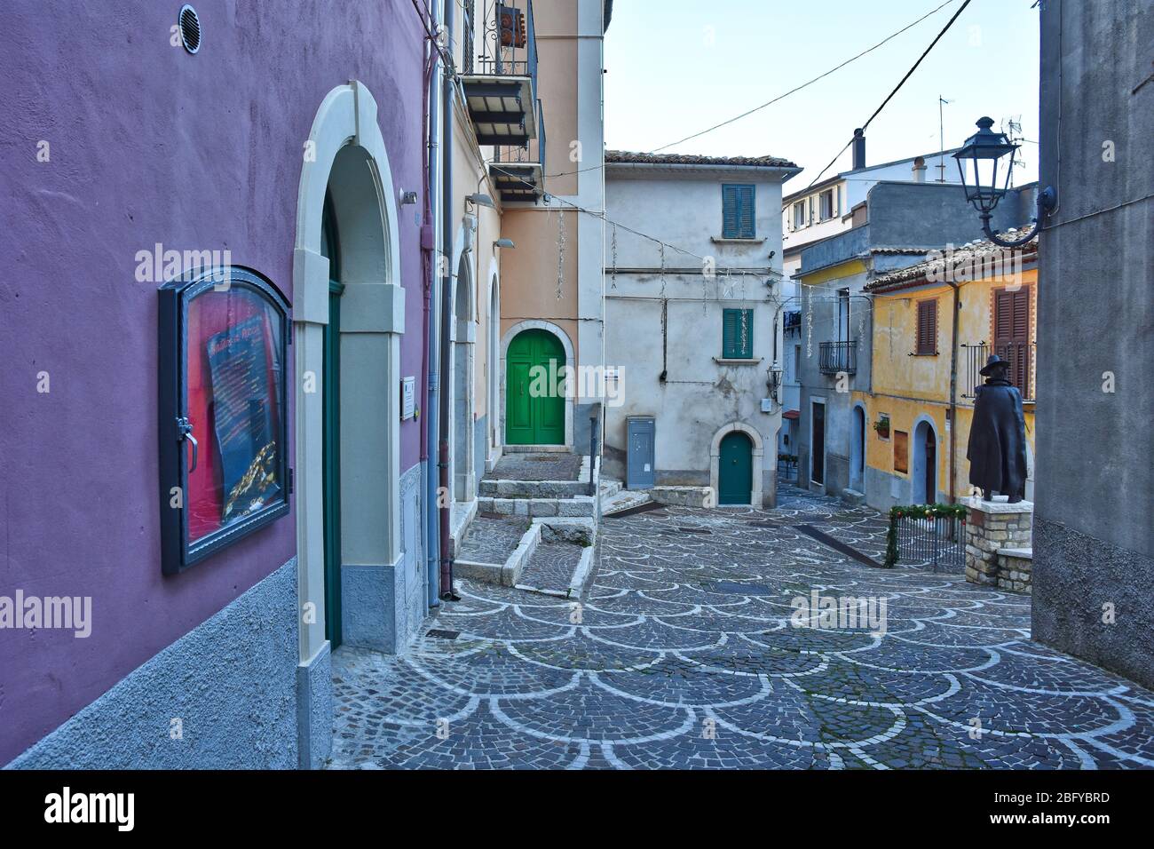 A narrow street between the old houses of Roccamandolfi in the Molise ...