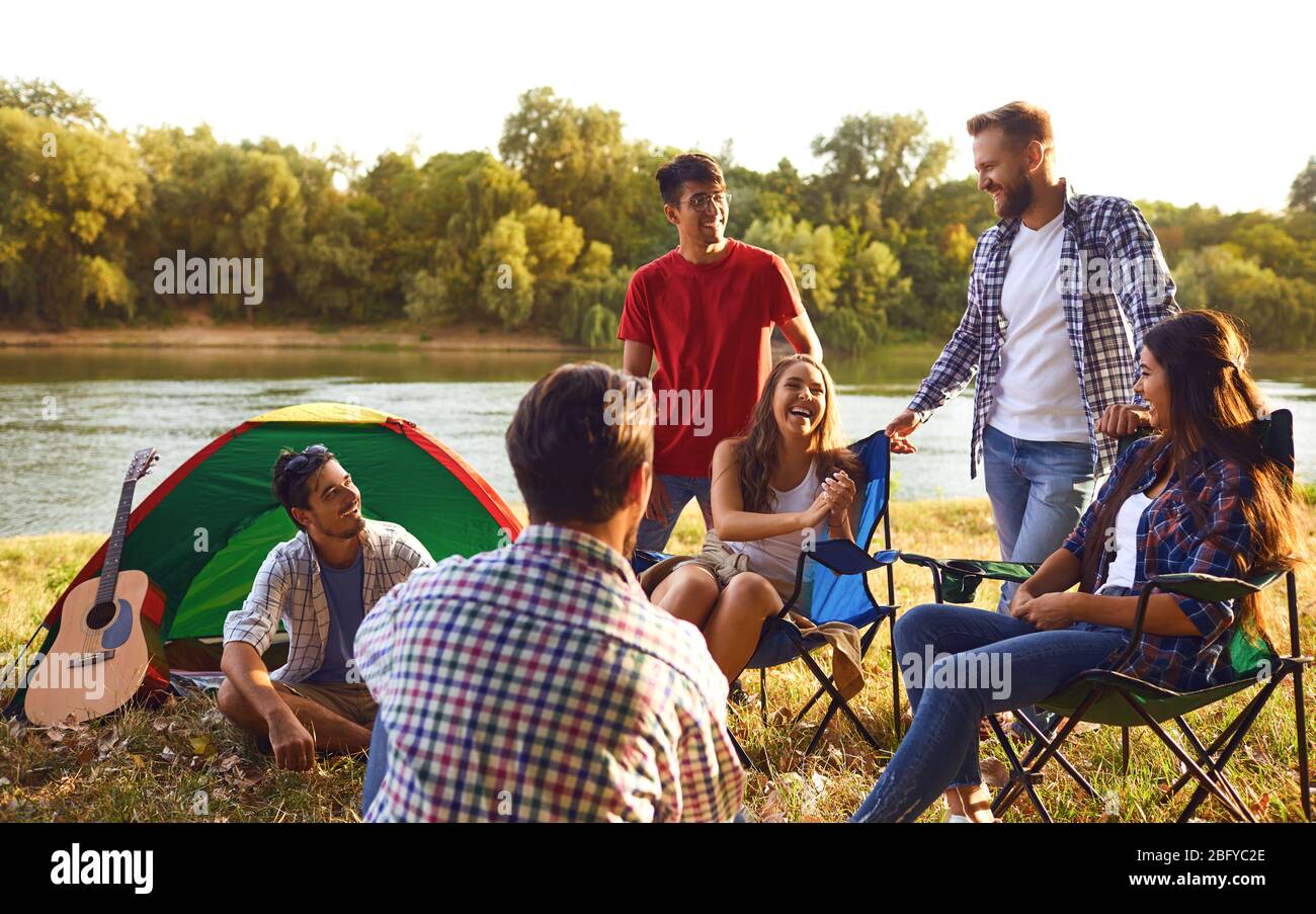 A group of friends have a picnic in a forest in autumn Stock Photo - Alamy