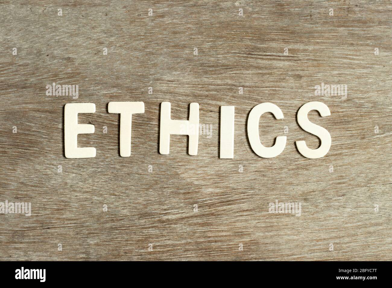 Alphabet letter in word ethics on wood background Stock Photo - Alamy