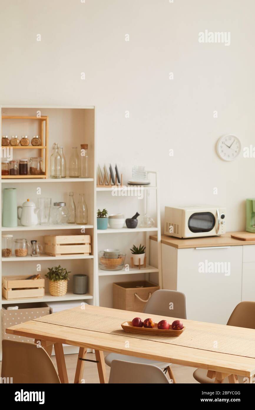 Vertical background image of warm-toned kitchen interior with minimal ...