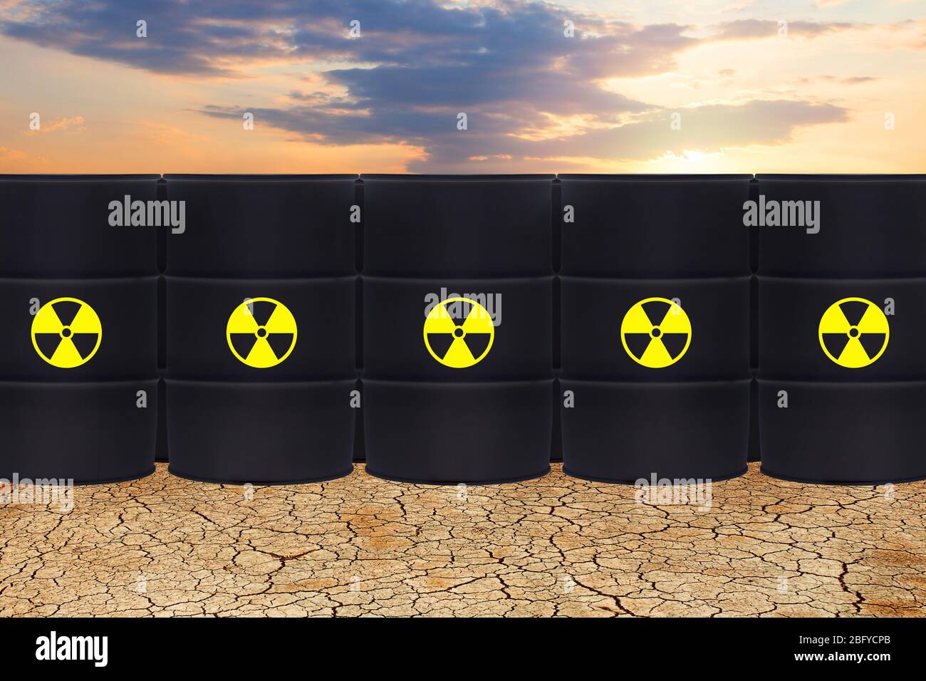 Radioactive waste against dry earth and sky clouds. Environment ...
