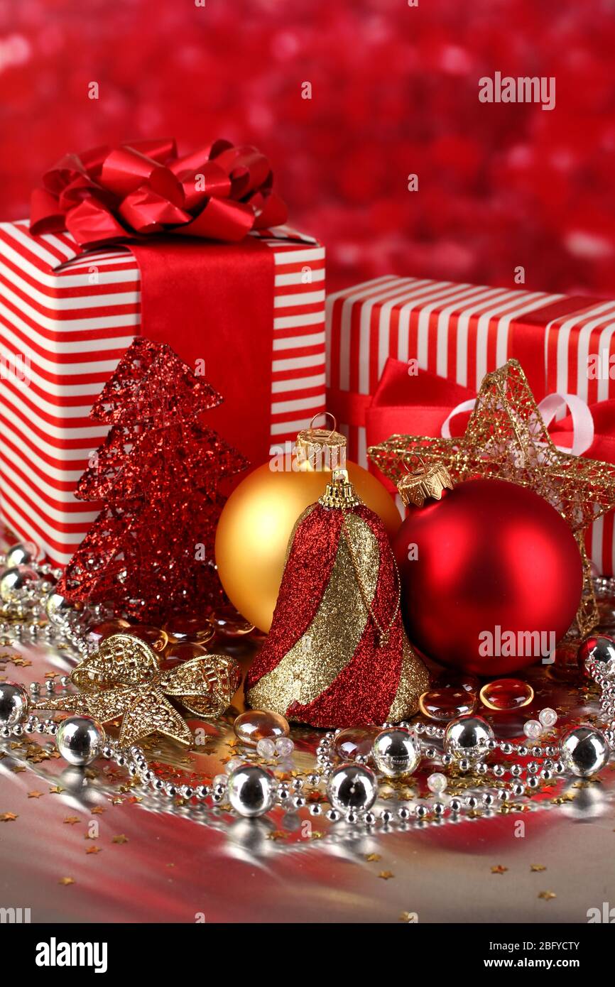 Christmas decoration and gifts on red background Stock Photo - Alamy