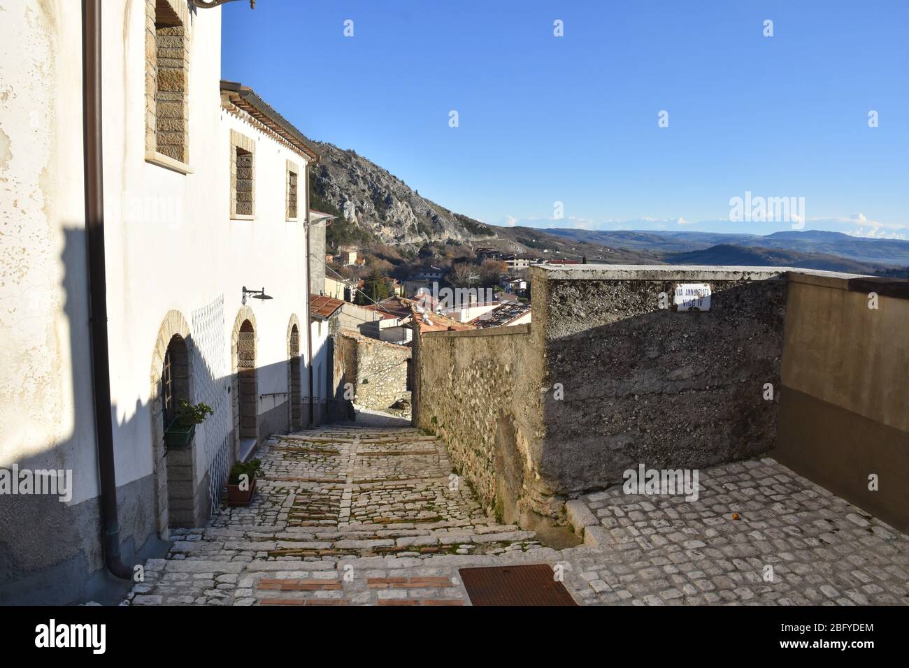 A narrow street between the old houses of Roccamandolfi in the Molise ...