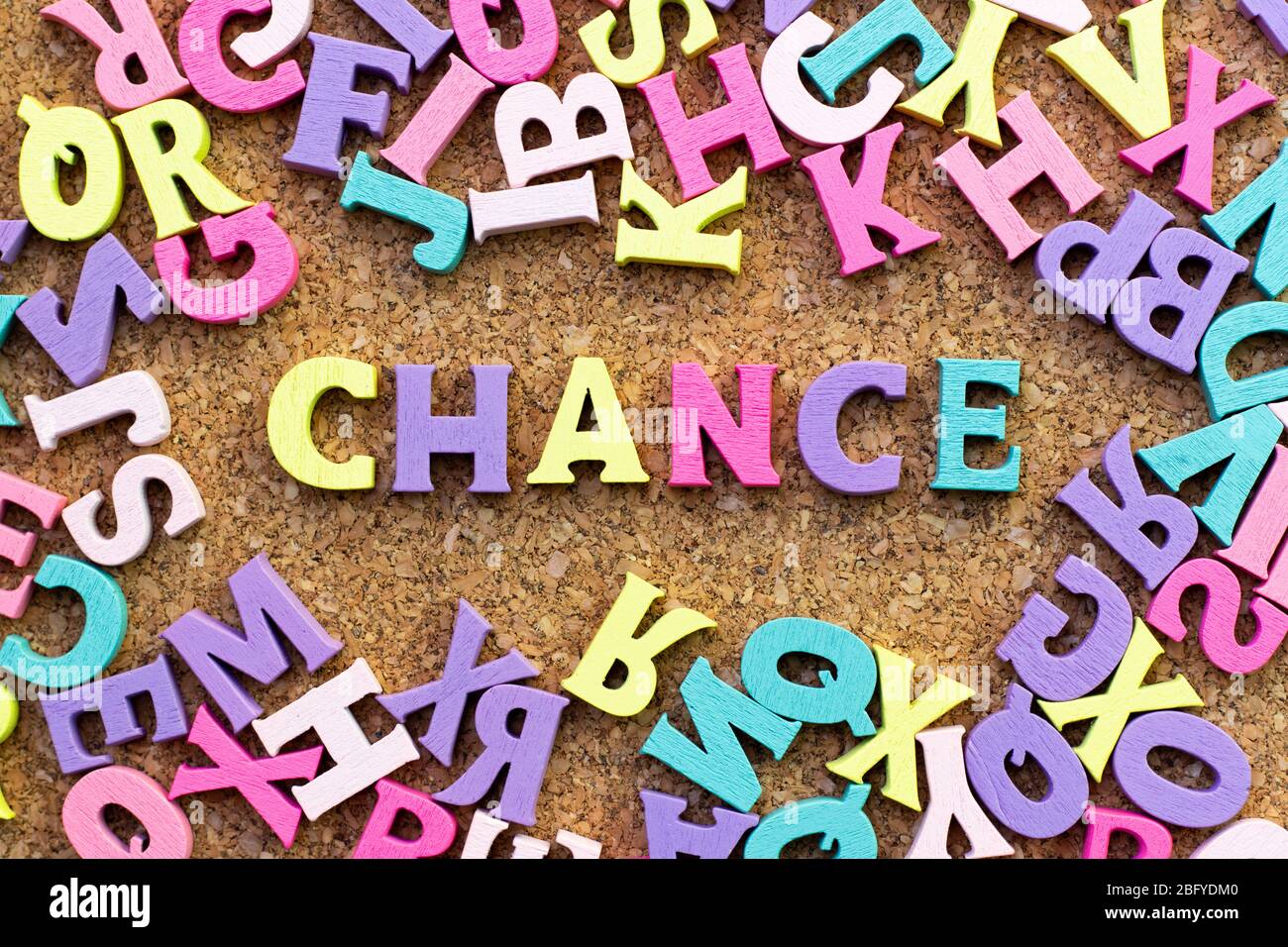Color alphabet in word chance with another letter on cork board ...