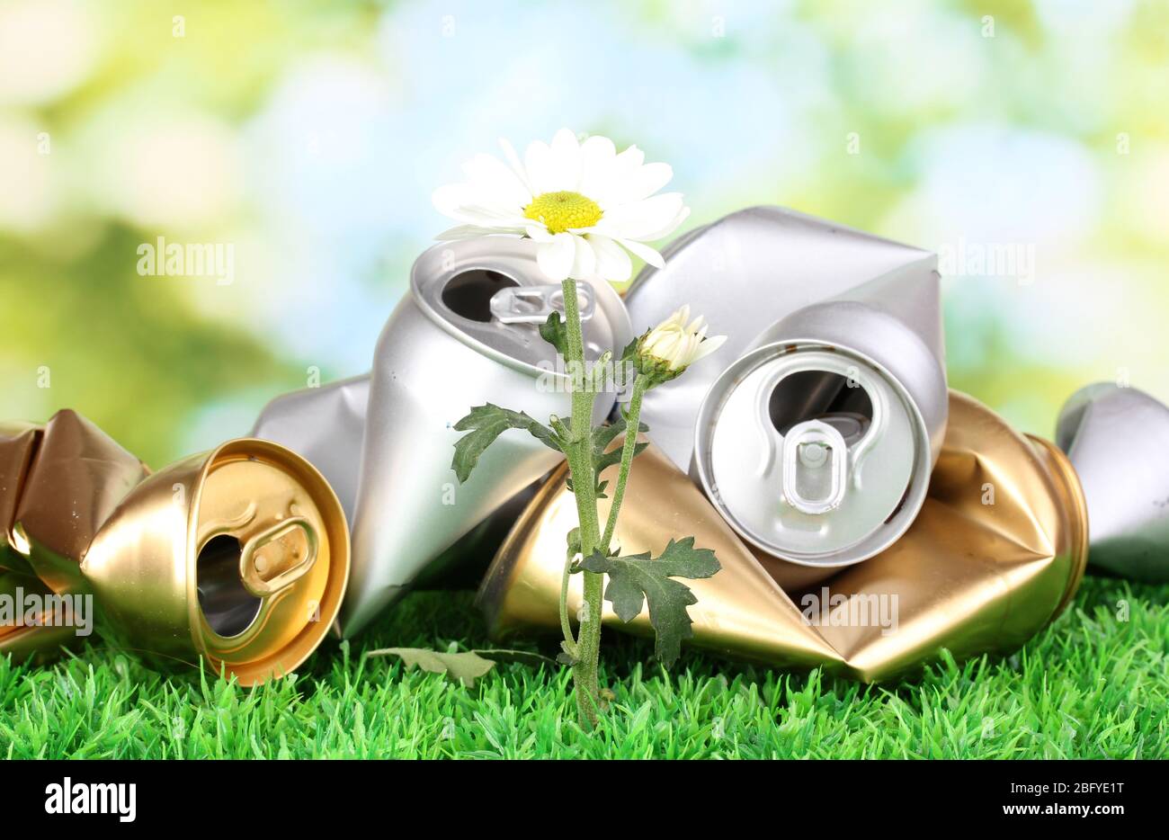 Garbage with growing flower. Environmental conservation concept Stock ...